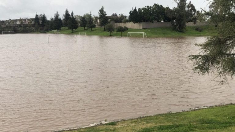 Rain fills up soccer field basins in Santa Maria